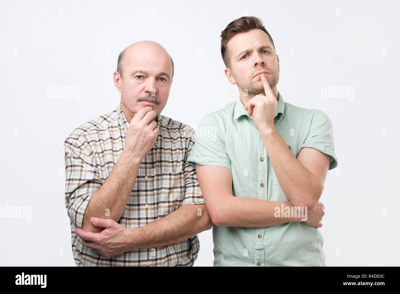 Puzzled men have puzzled looks, feel bewilderment Stock Photo - Alamy