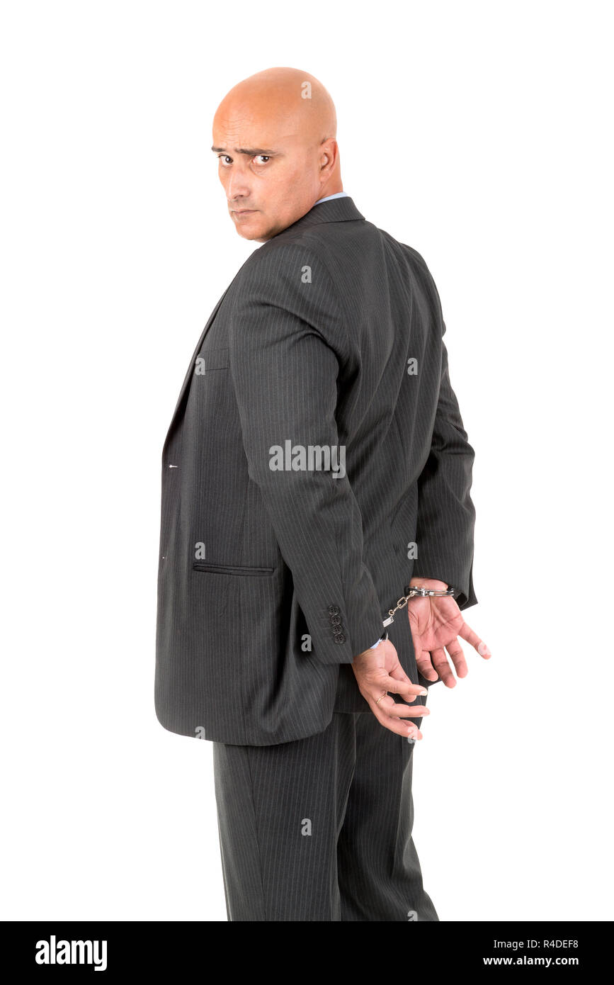 Businessman in handcuffs Stock Photo - Alamy