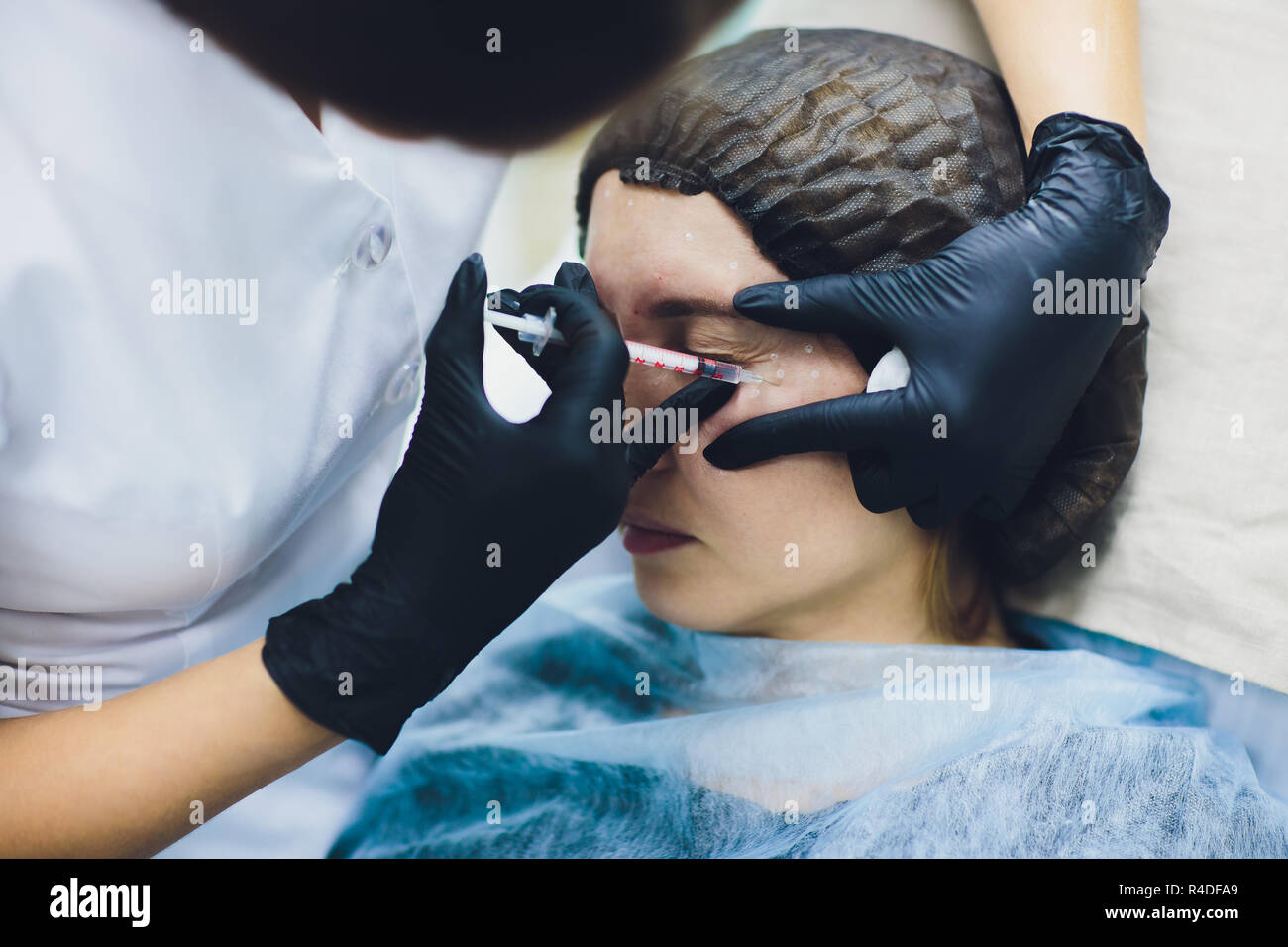 Cosmetologist Doctor Make Facial Beauty Injections To Her Woman Client