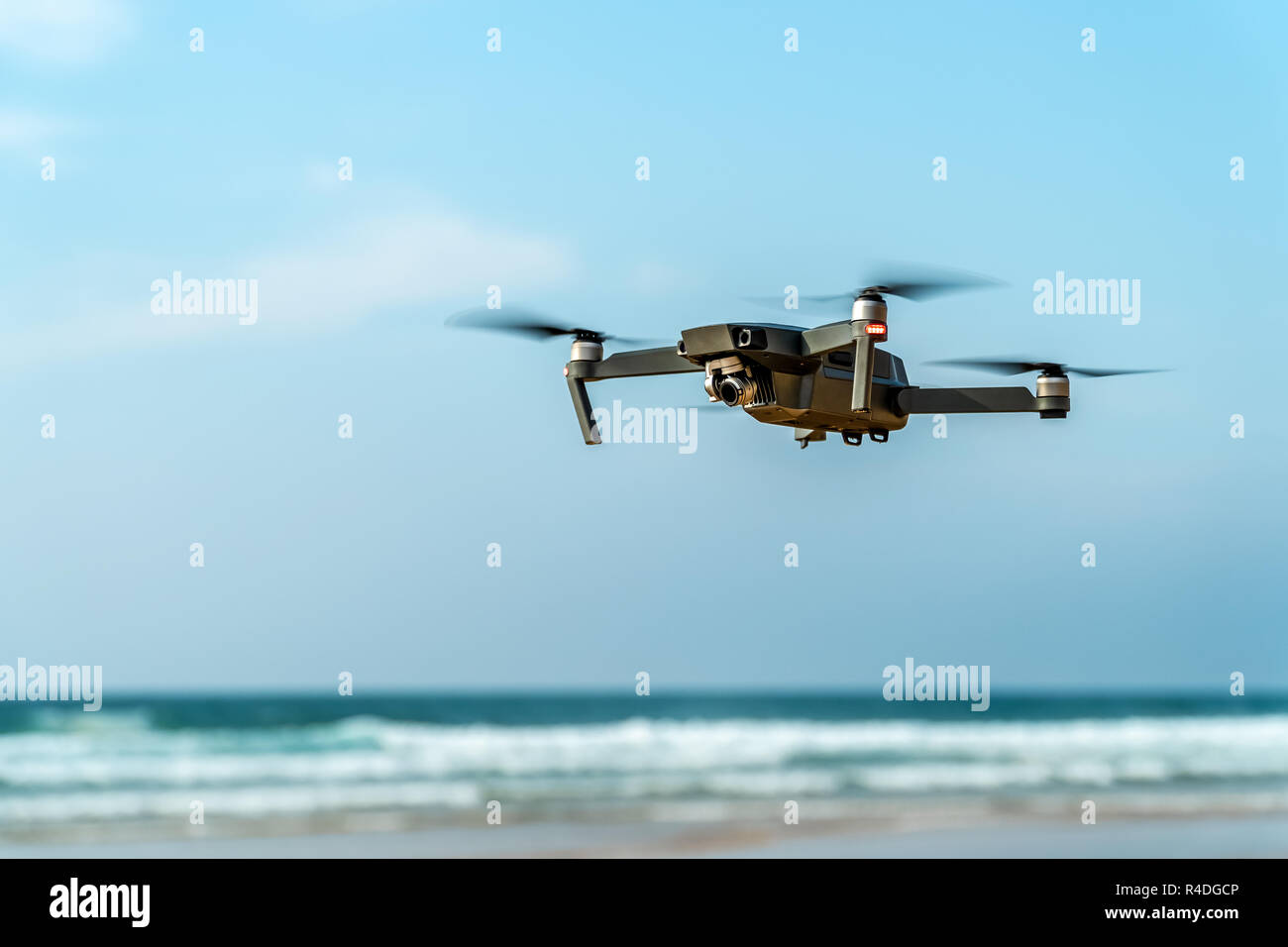 UAV Drone Quadcopter And Digital Camera Flying On Beach Stock Photo - Alamy