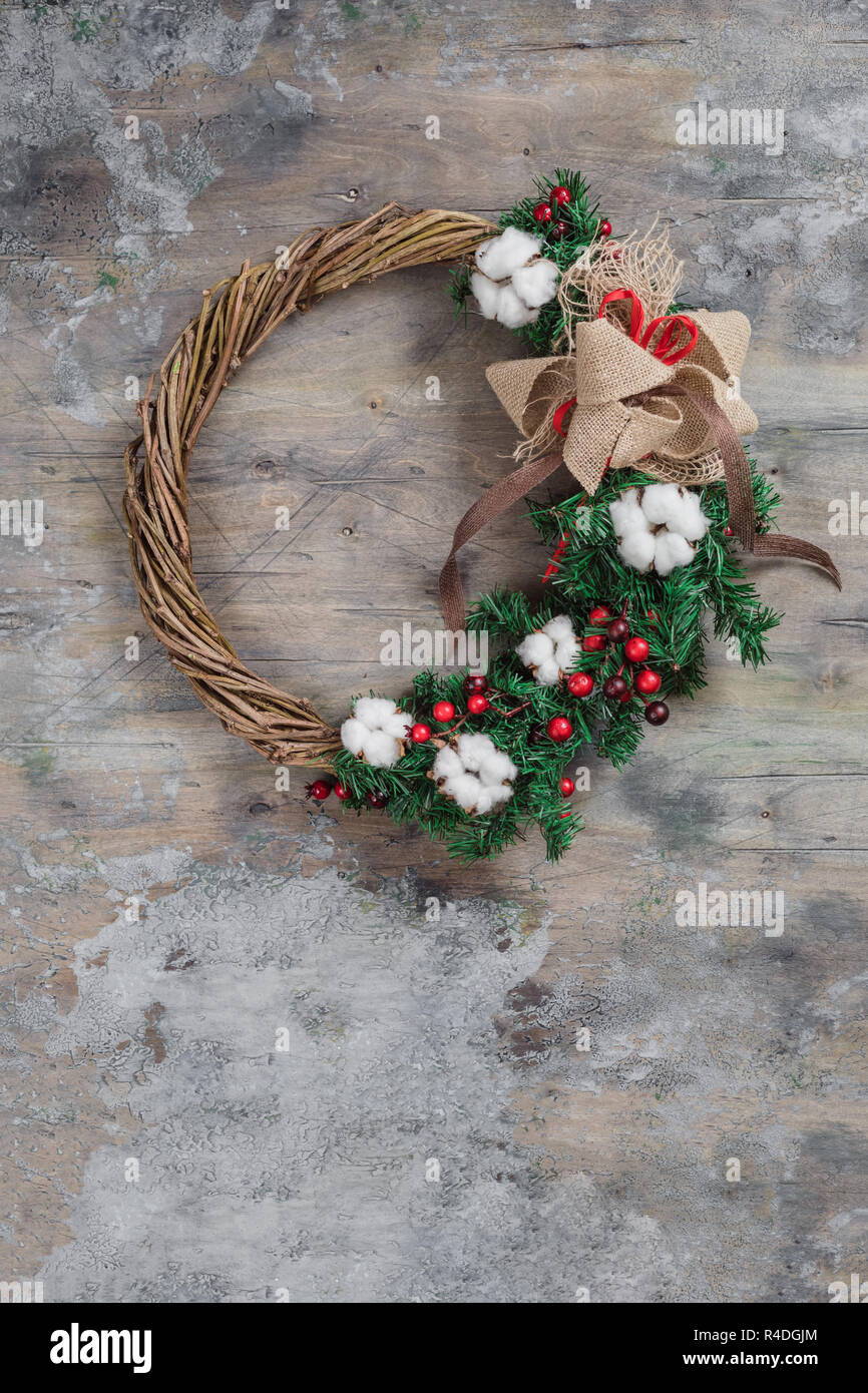 Handmade Christmas wreath on a rustic background Stock Photo - Alamy