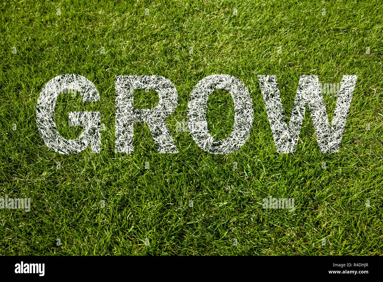 grow written on grass Stock Photo - Alamy
