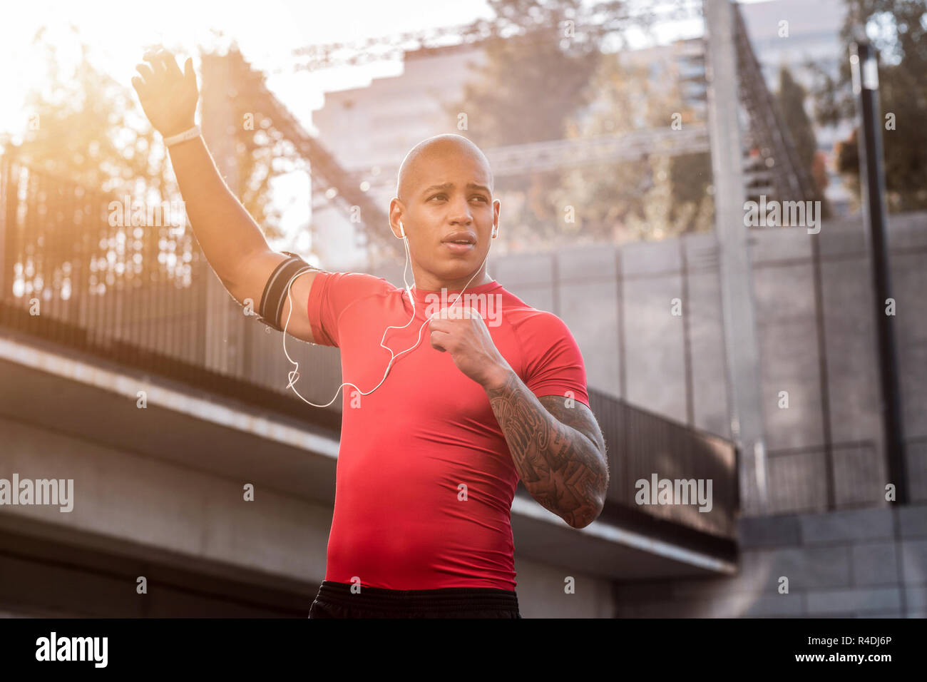 Nice good looking man holding his hand up Stock Photo - Alamy