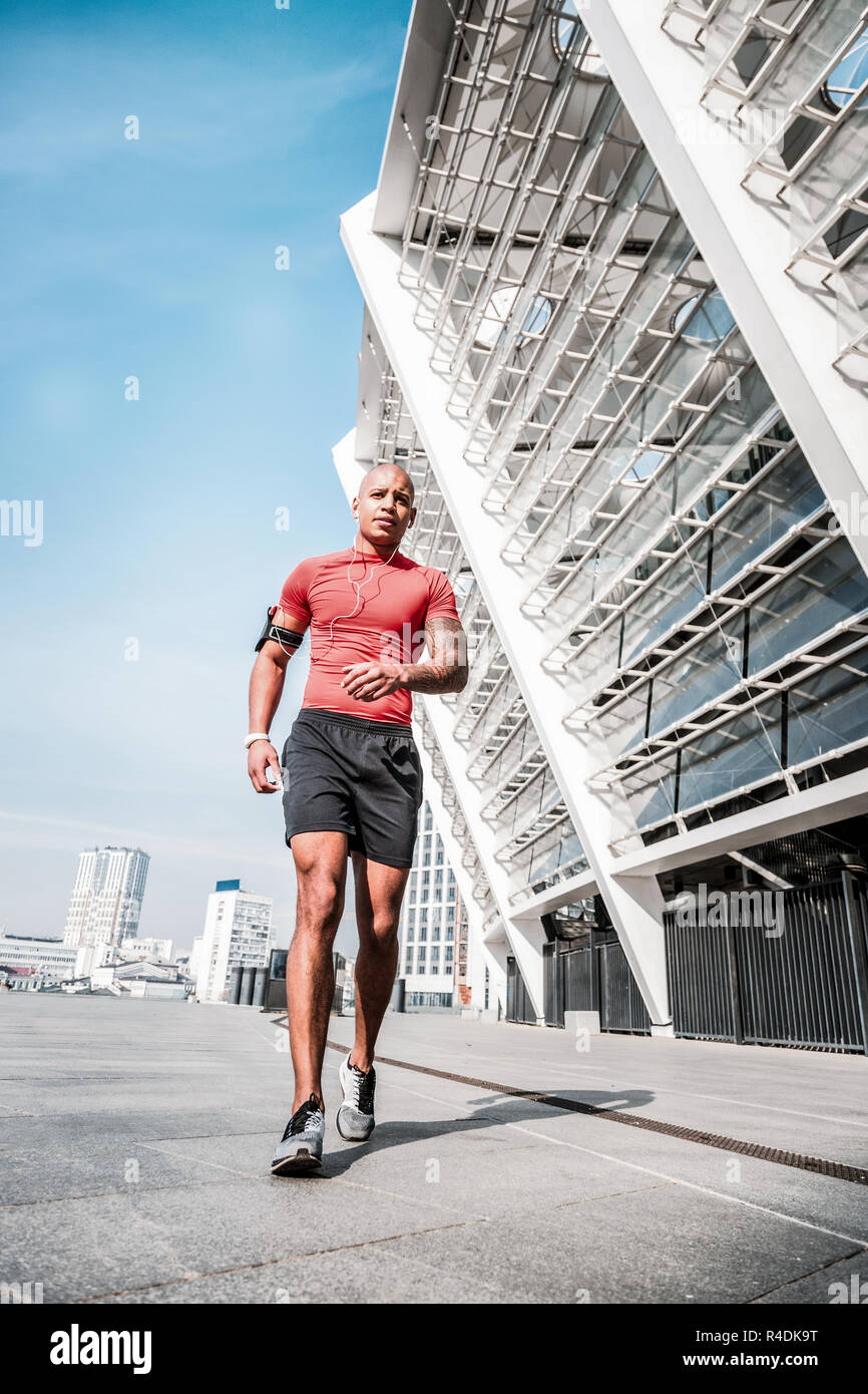 Nice good looking man running towards you Stock Photo - Alamy