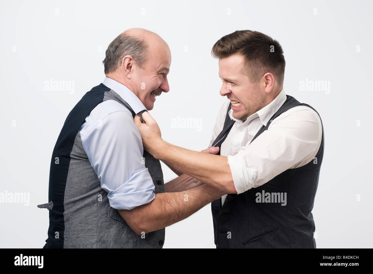 Business competition and confrontation concept. Two men are fighting ...