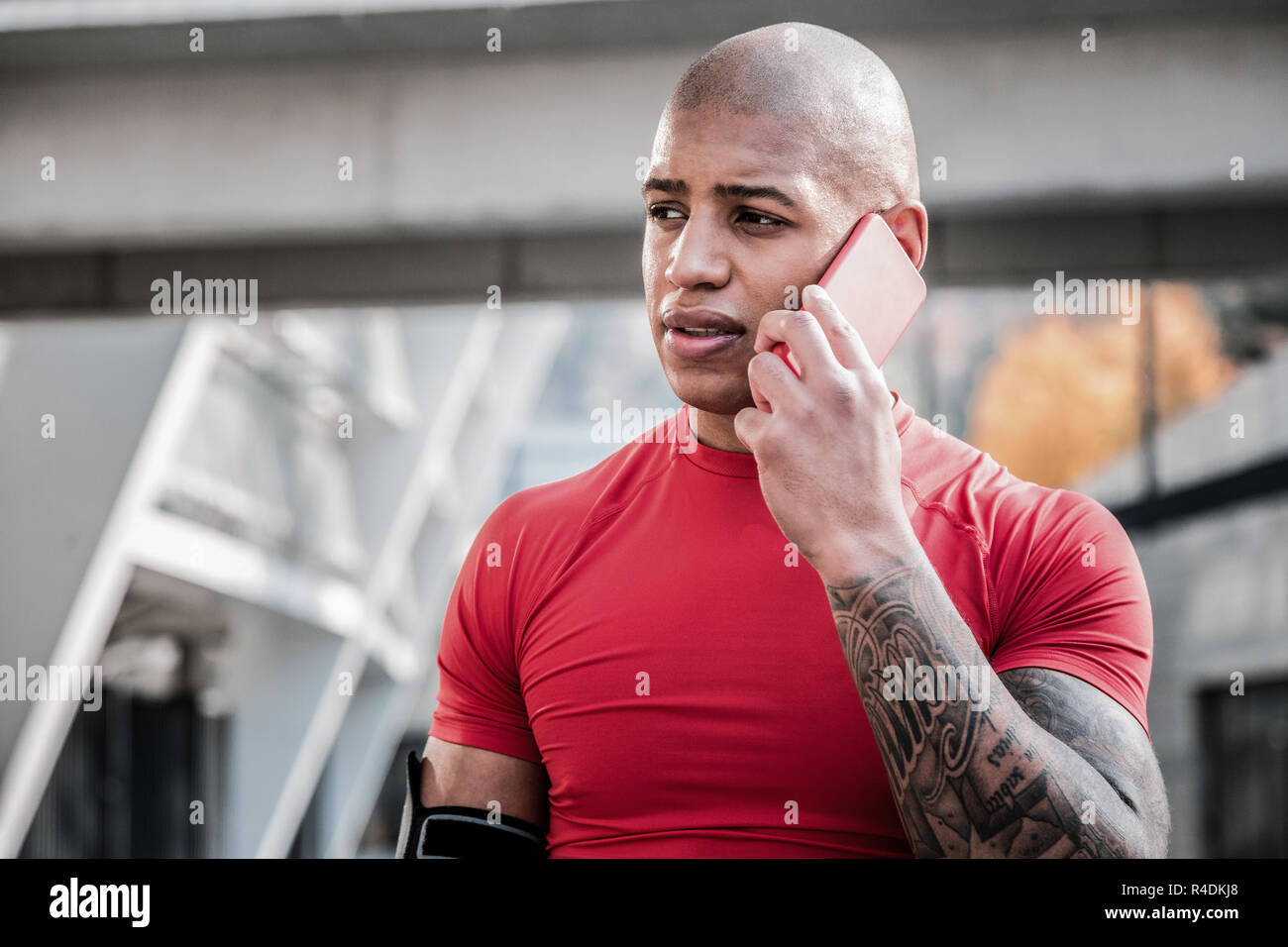 Nice serious man answering the phone call Stock Photo - Alamy