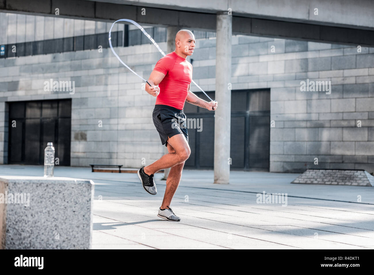 Man jumping on jump rope hi-res stock photography and images - Alamy