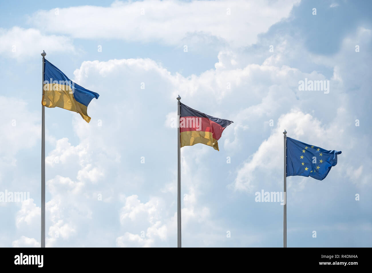 The Ukrainian, German flags and flag of the European Union against the ...