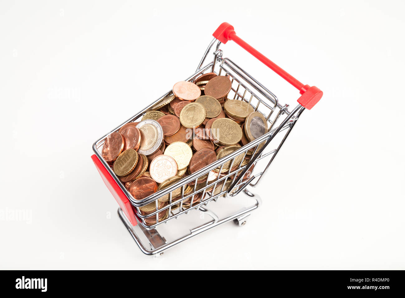 shopping cart with coins Stock Photo - Alamy