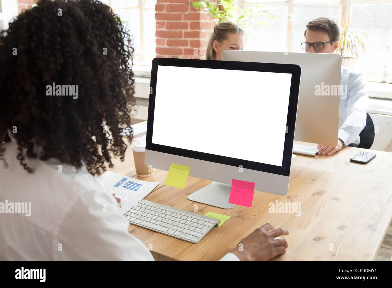 African American worker using computer at workplace Stock Photo - Alamy