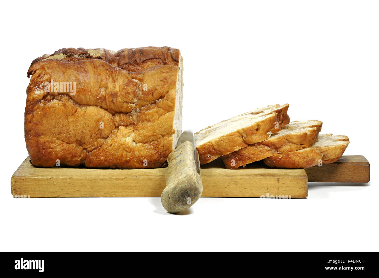 Frisian Suikerbrood (sugar bread) with knife and wooden plate isolated ...