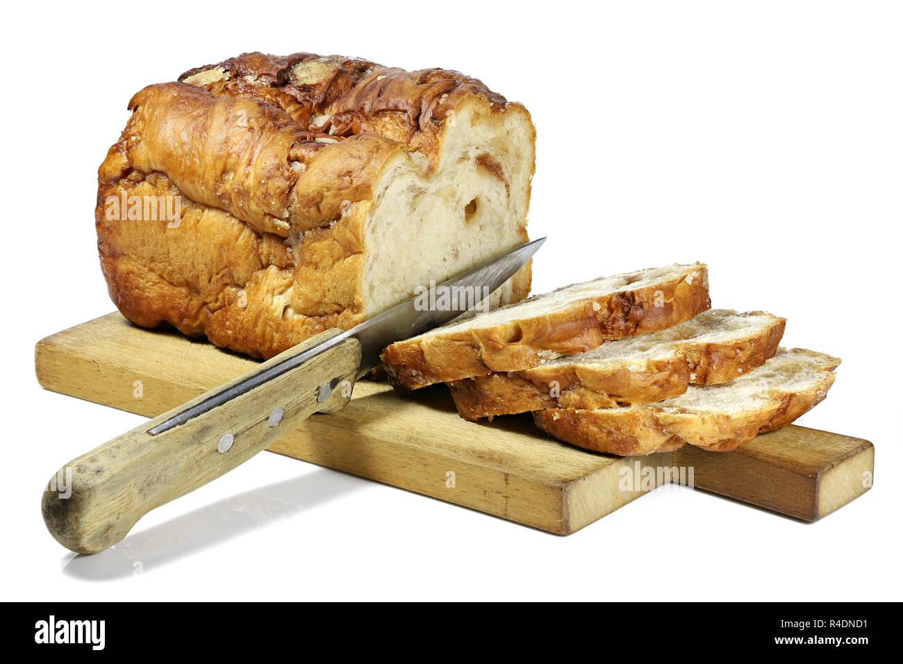 Frisian Suikerbrood (sugar bread) with knife and wooden plate isolated ...