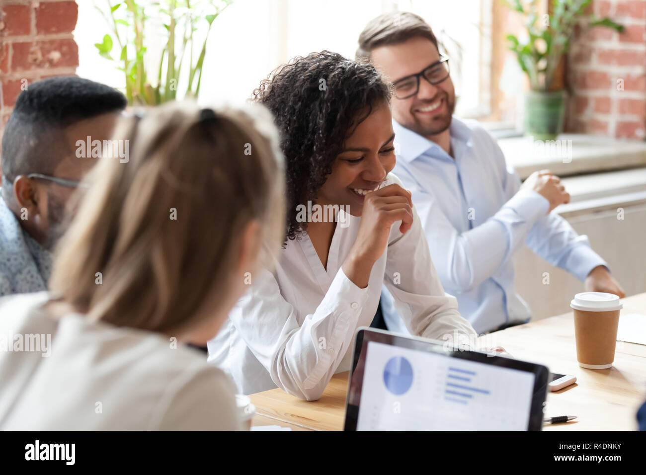 Multiracial group of colleagues having fun at meeting Stock Photo - Alamy