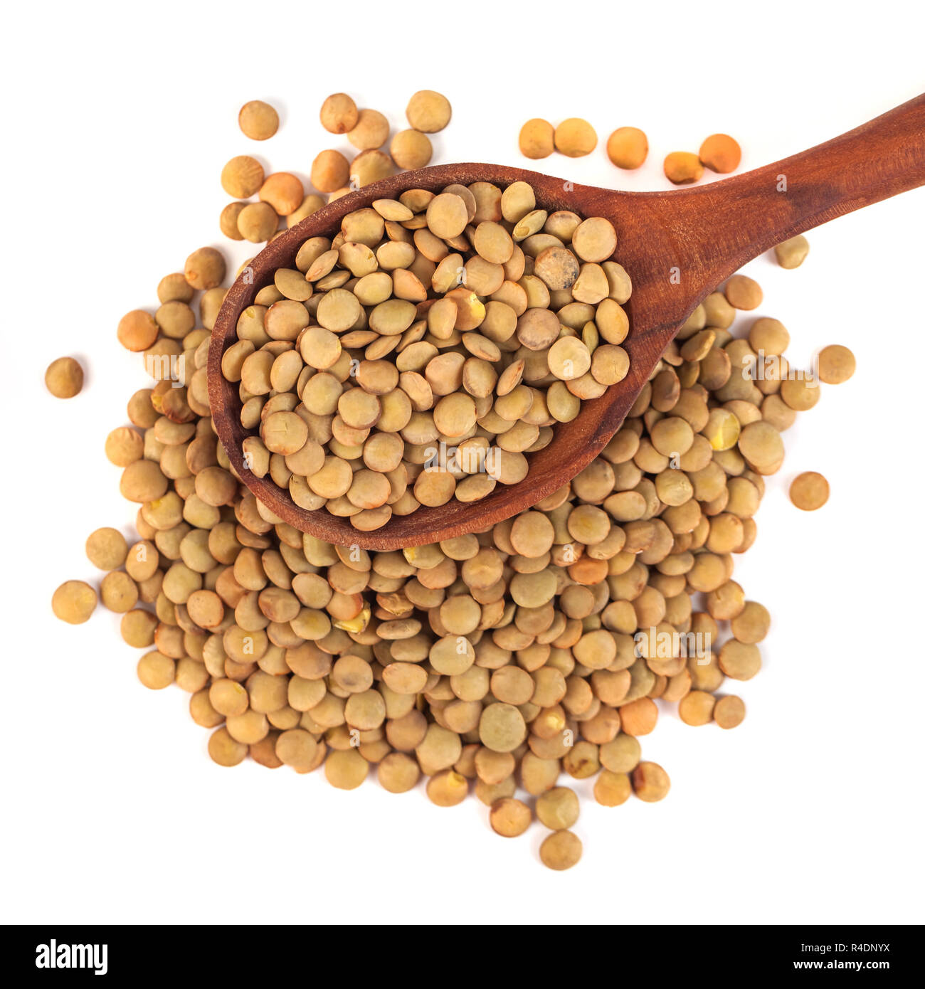dry lentils on wooden spoon isolated on a white background Stock Photo ...