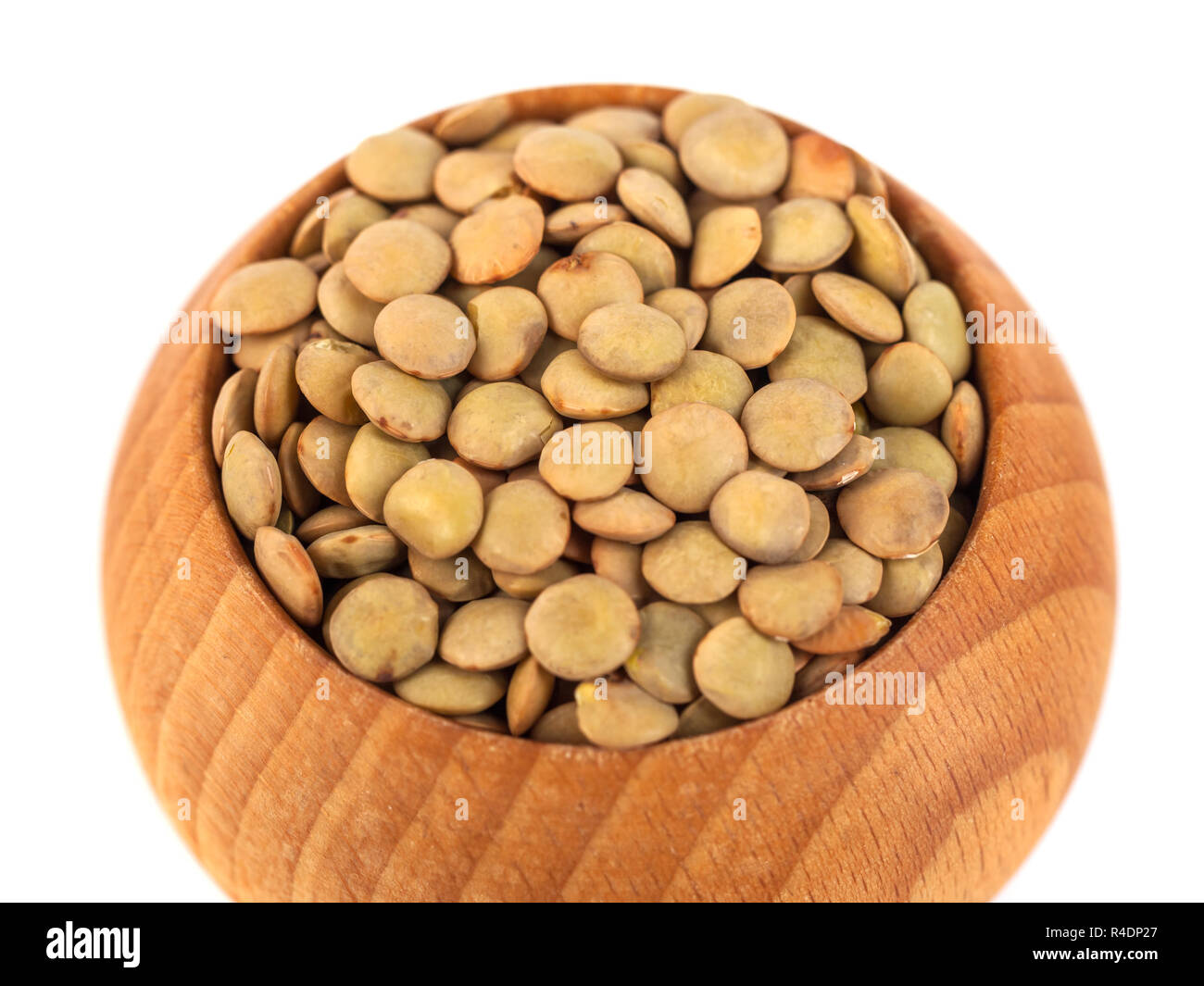 dry lentils on wooden bowl isolated on a white background Stock Photo ...