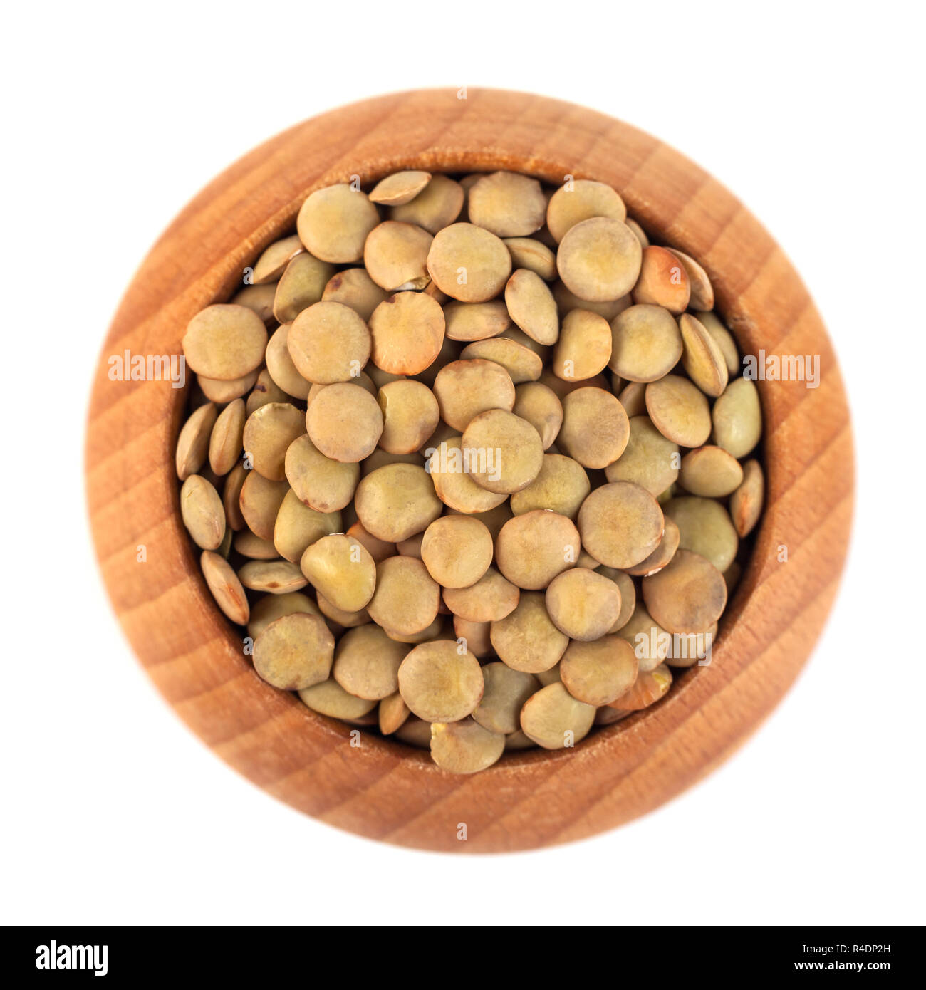 dry lentils on wooden bowl isolated on a white background Stock Photo - Alamy