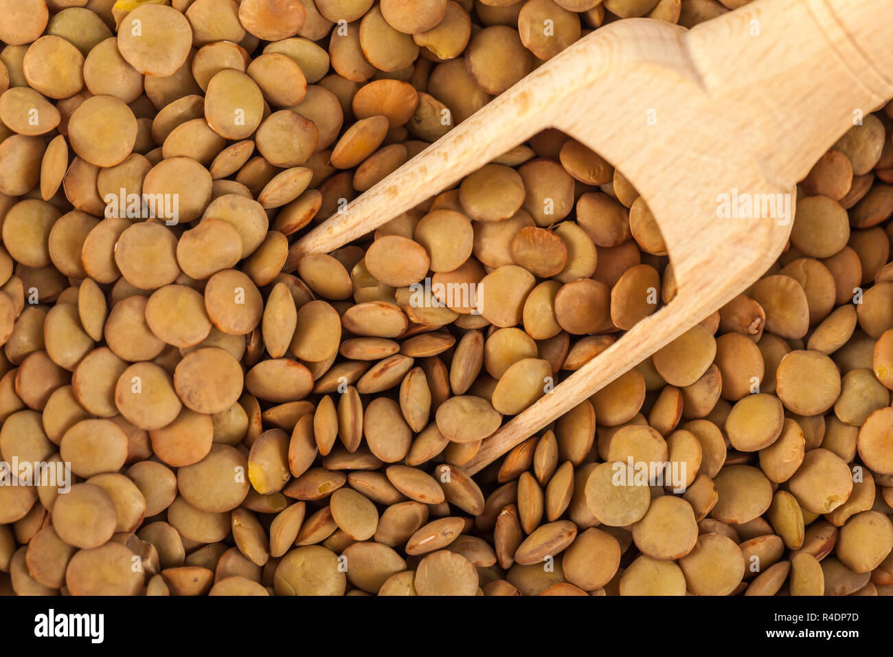 dry lentils on wooden spoon, healthy food Stock Photo - Alamy
