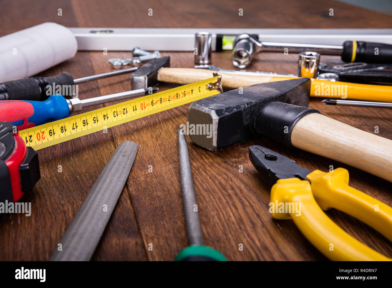 Construction Tools With Blueprint On Desk Stock Photo - Alamy