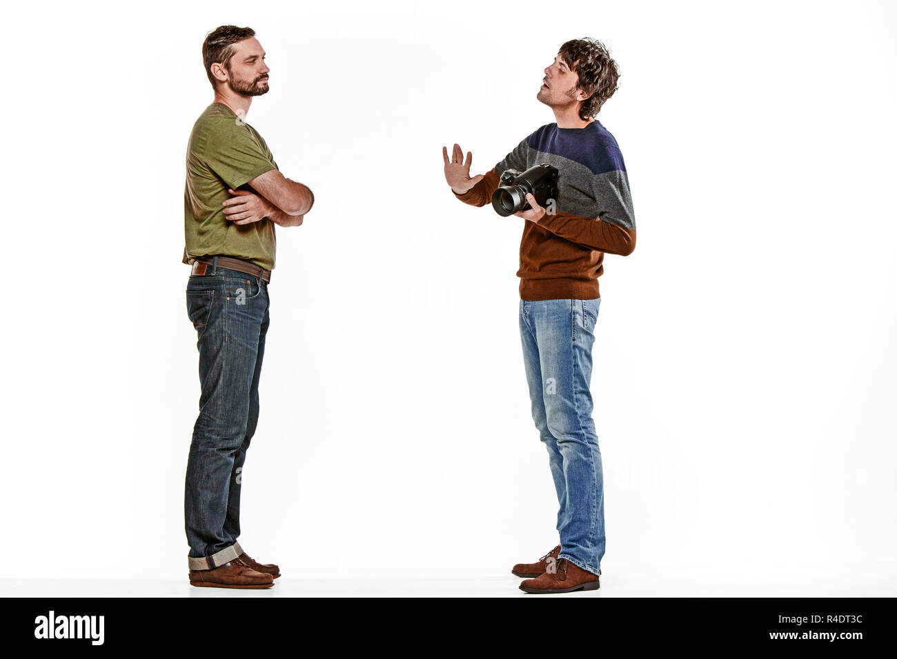 Friends with camera on white Stock Photo - Alamy