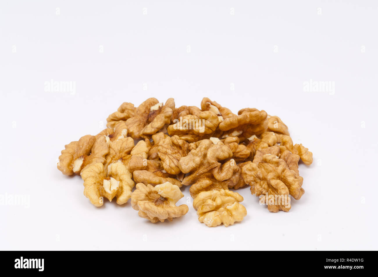 Pile of walnuts on white background Stock Photo - Alamy