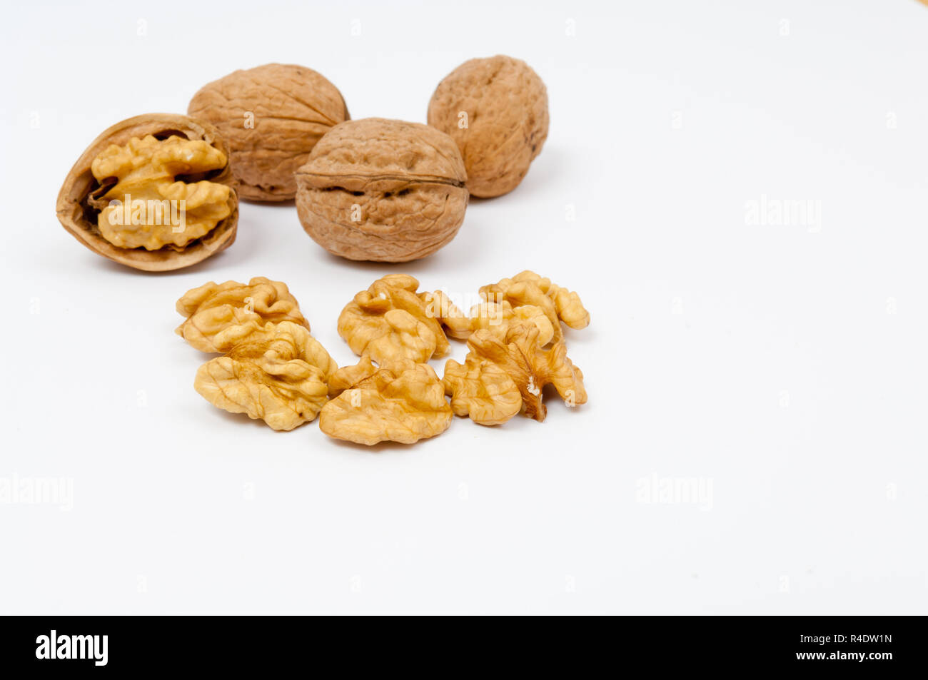 Pile of walnuts on white background Stock Photo - Alamy