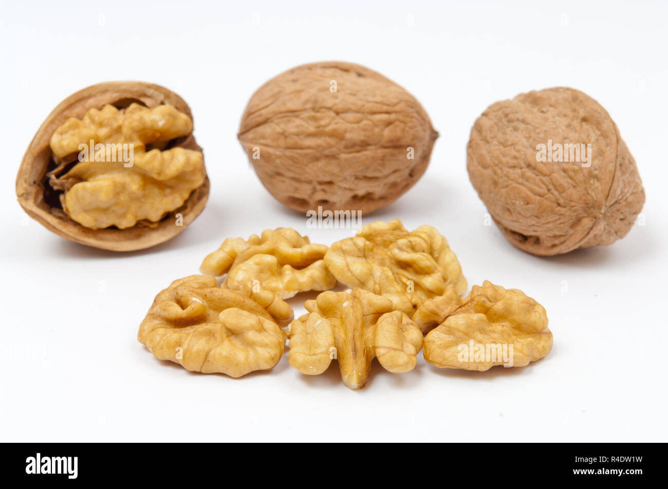 Pile of walnuts on white background Stock Photo - Alamy