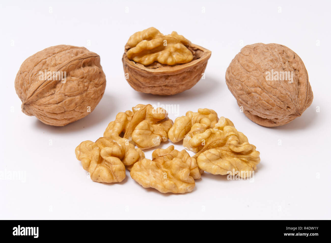 Pile of walnuts on white background Stock Photo - Alamy