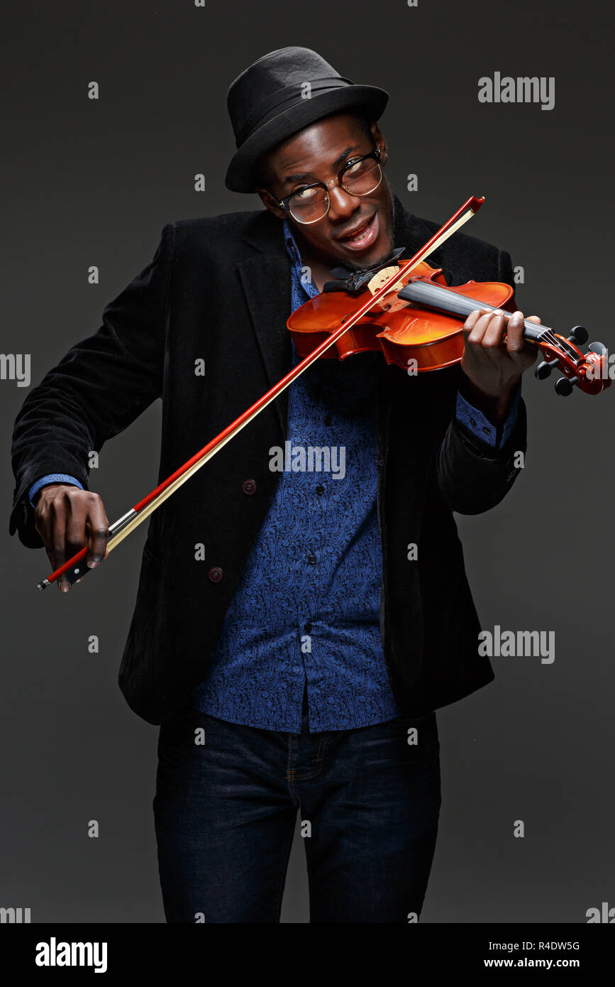 The black man happy expression and music instrument Stock Photo - Alamy
