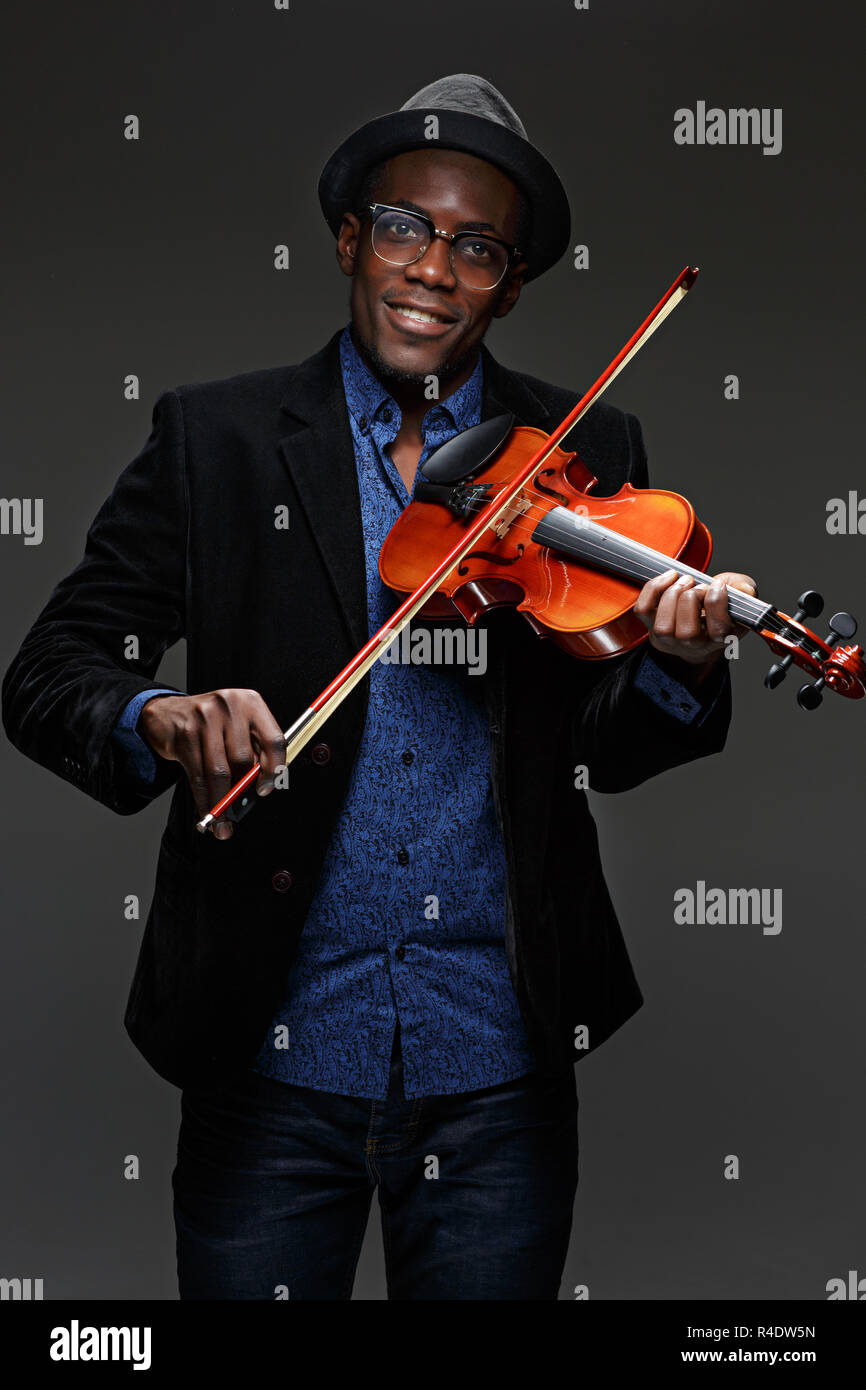 The black man happy expression and music instrument Stock Photo - Alamy