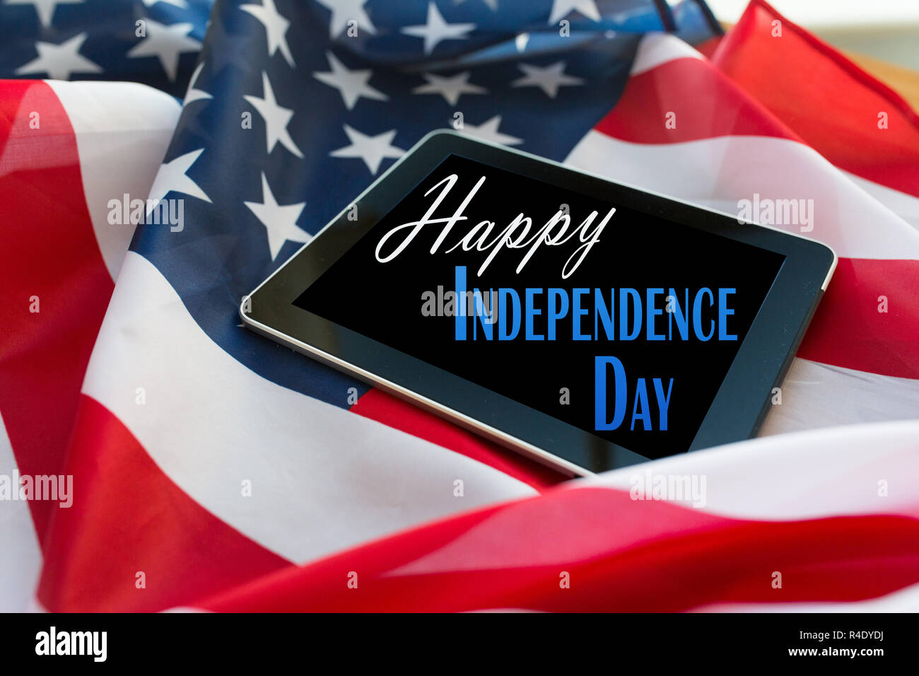 happy independence day on tablet pc american flag Stock Photo - Alamy