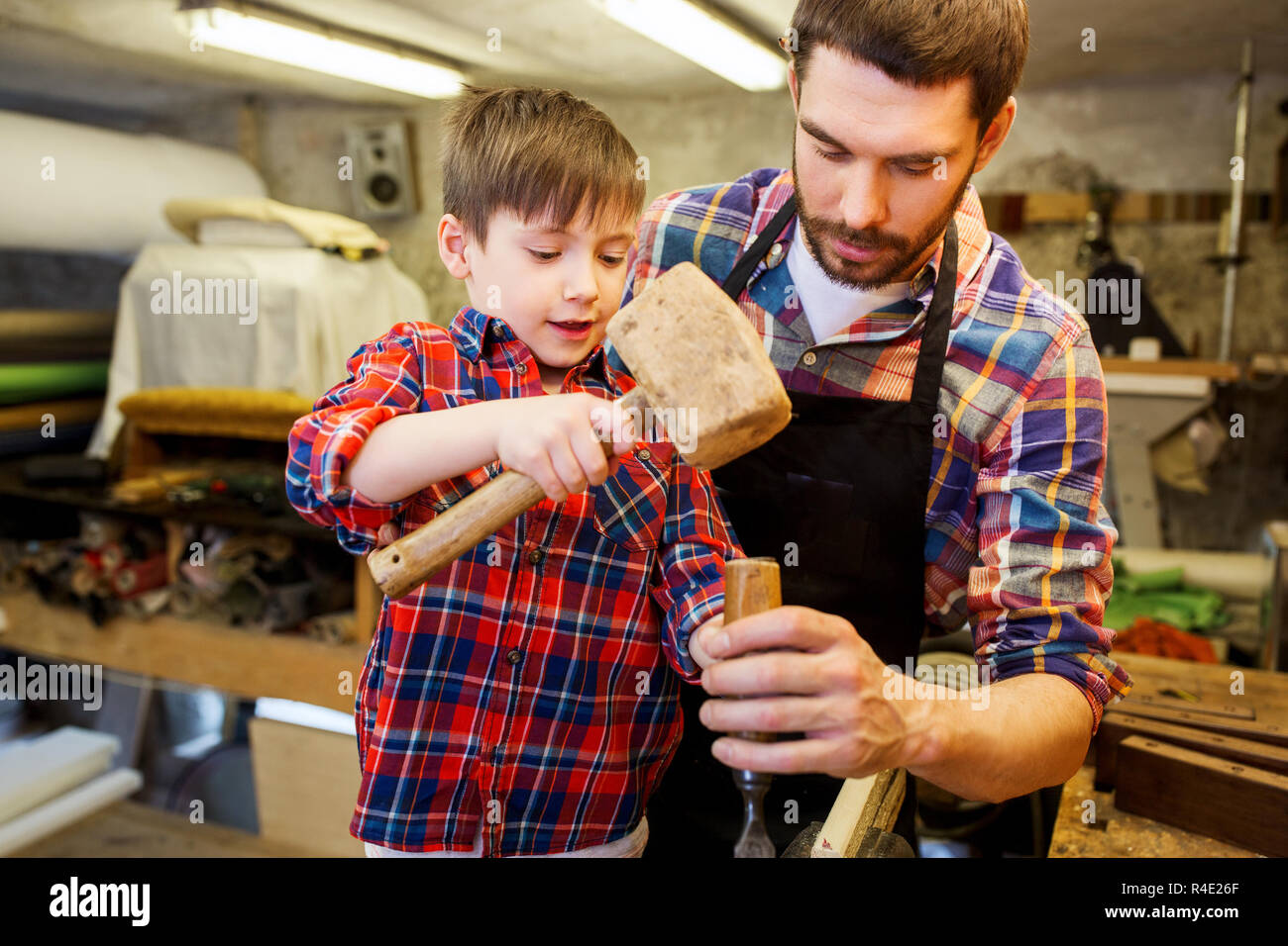 Father son hammer working workshop hi-res stock photography and images ...
