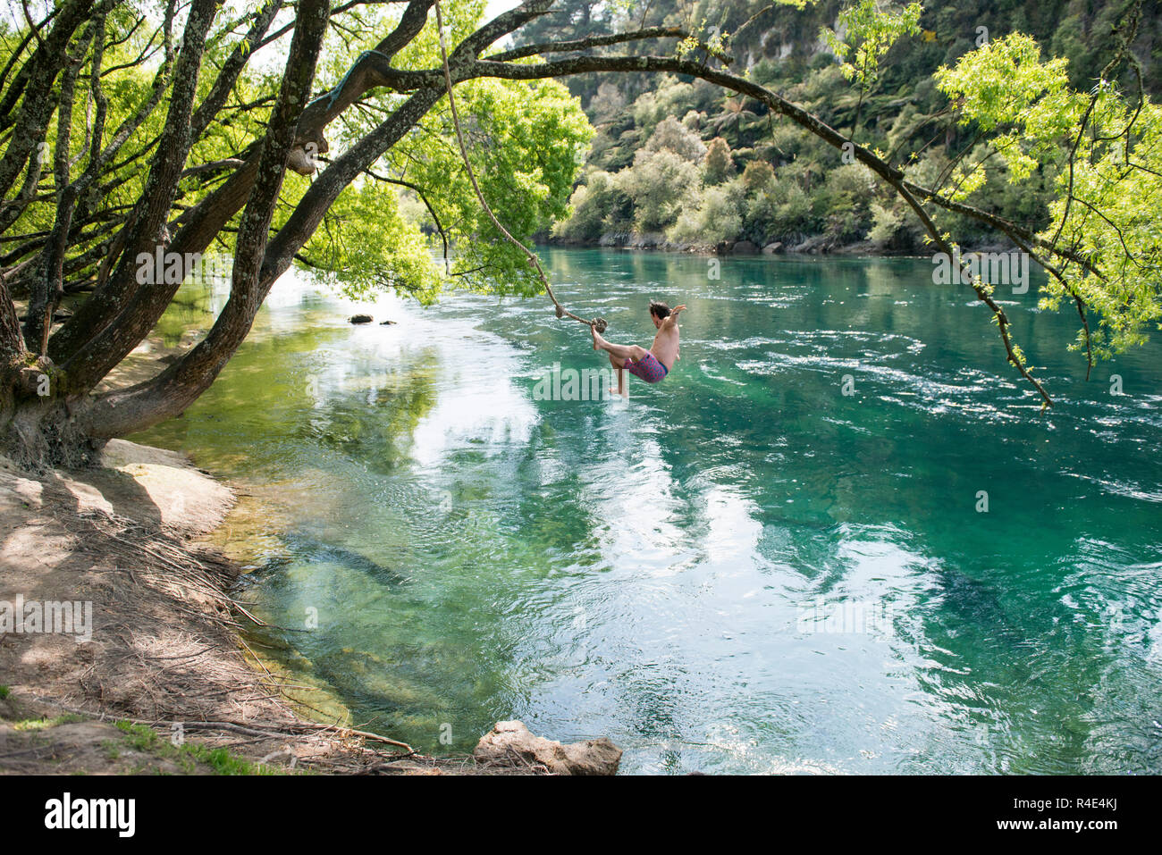Jumping to the river, freedom Stock Photo - Alamy