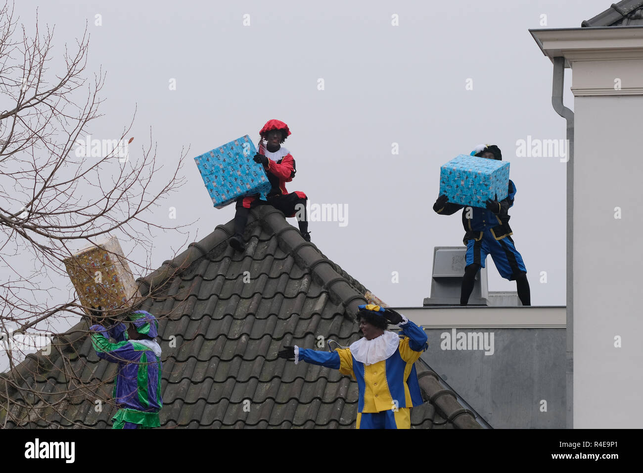 People dressed as Dutch traditional characters known as Zwarte Piet or ...