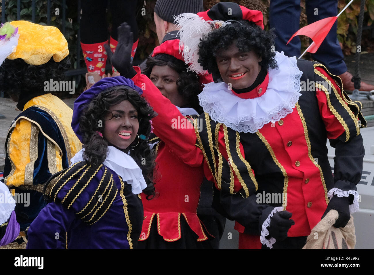 People dressed as traditional characters known as Zwarte Piet or Black ...