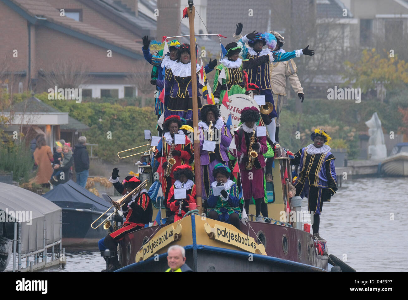 People dressed as traditional characters known as Zwarte Piet or Black ...