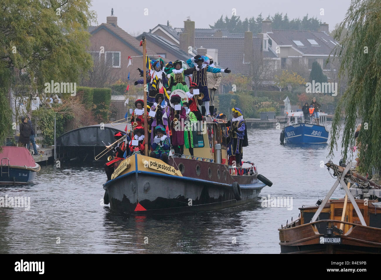 People dressed as traditional characters known as Zwarte Piet or Black ...