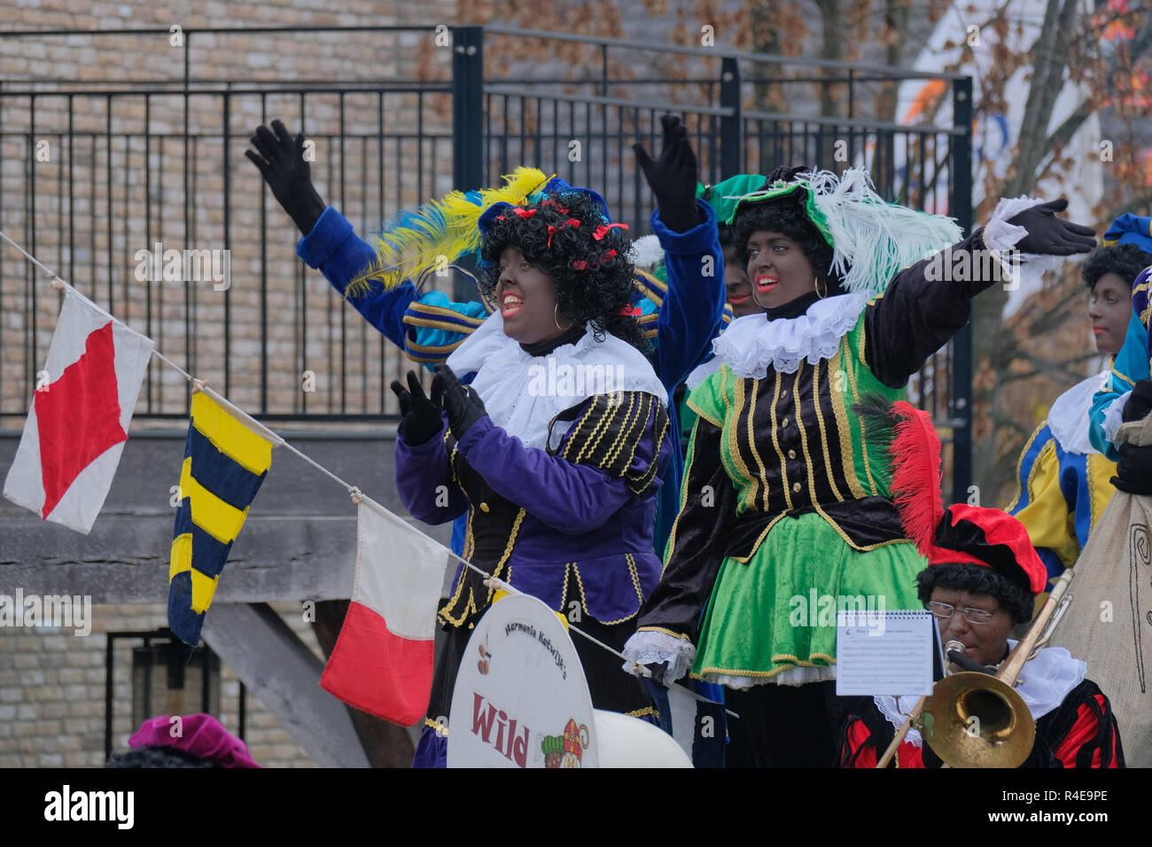 People dressed as traditional characters known as Zwarte Piet or Black ...