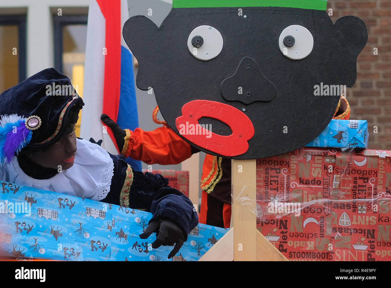 A participant dressed as a traditional character known as Zwarte Piet ...