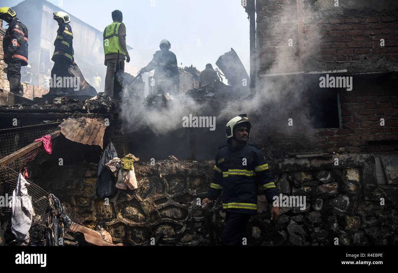 Mumbai, India. 27th Nov, 2018. Indian firemen douse a fire that broke ...