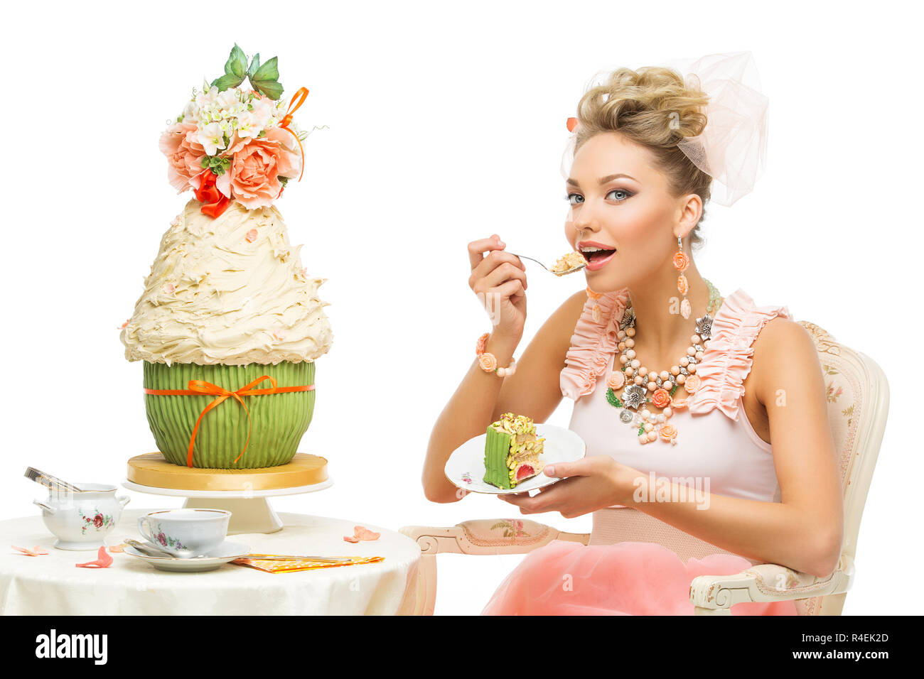 Girl eating cake Stock Photo - Alamy