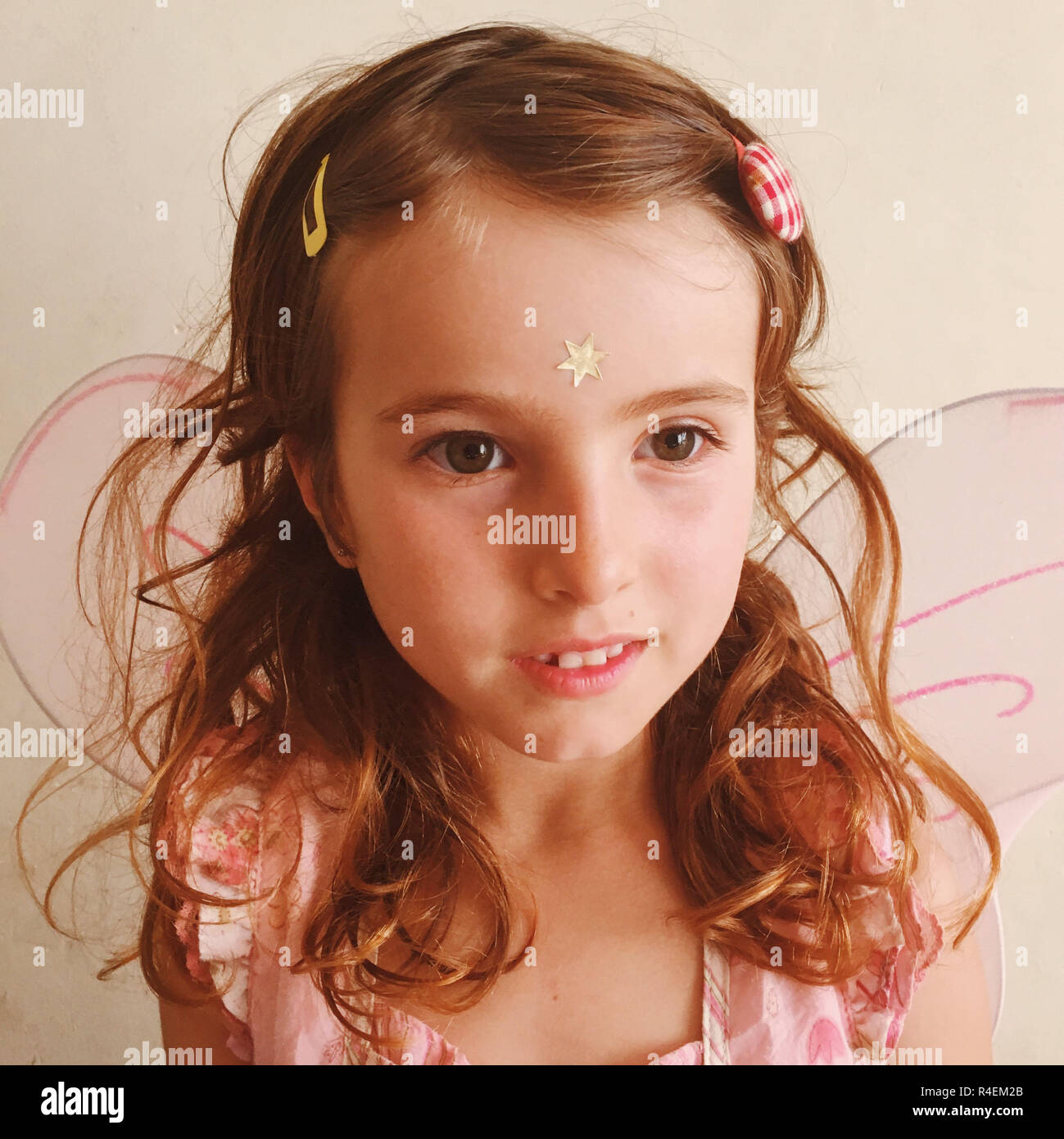Portrait of a girl wearing fairy wings Stock Photo - Alamy