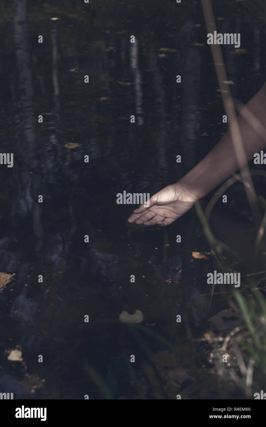 Woman's hand floating in a river, Bulgaria Stock Photo - Alamy