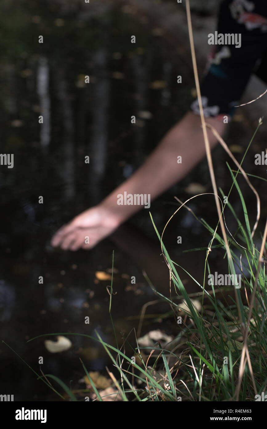 Woman touching arm her 45 hi-res stock photography and images - Alamy