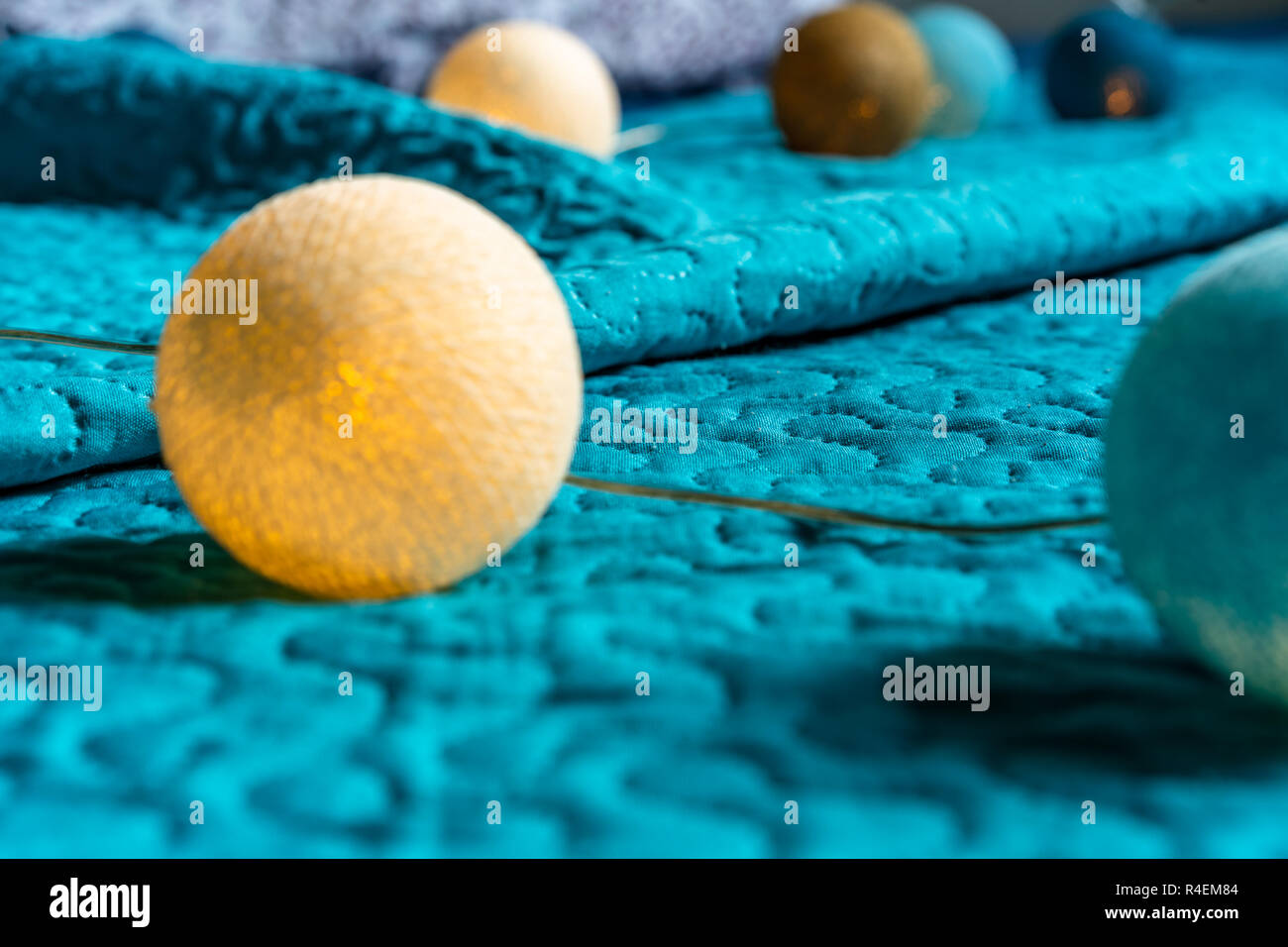 Christmas Decoration Light Balls Laying on Mattress with Turquoise ...