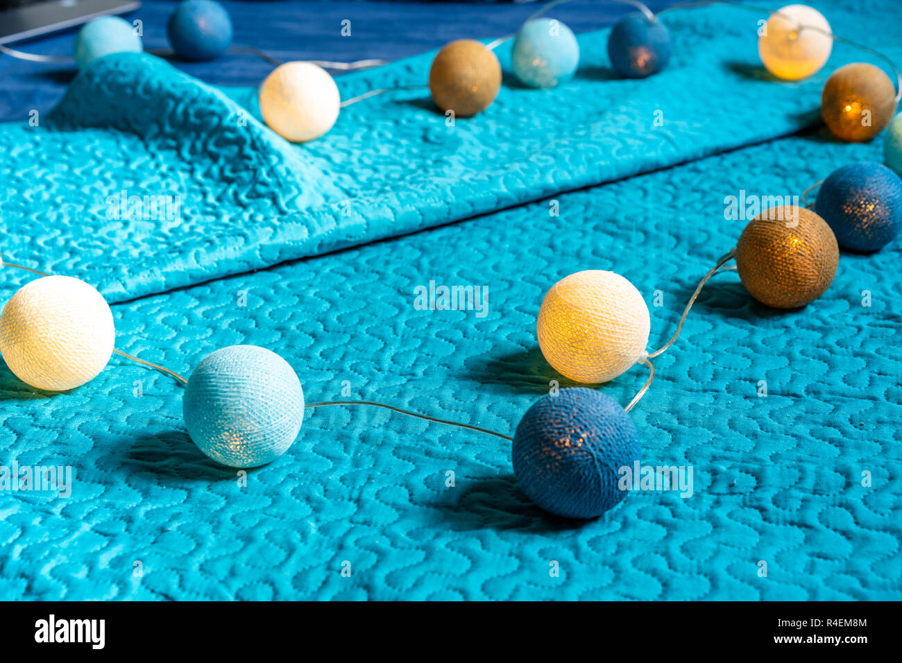 Christmas Decoration Light Balls Laying on Mattress with Turquoise ...