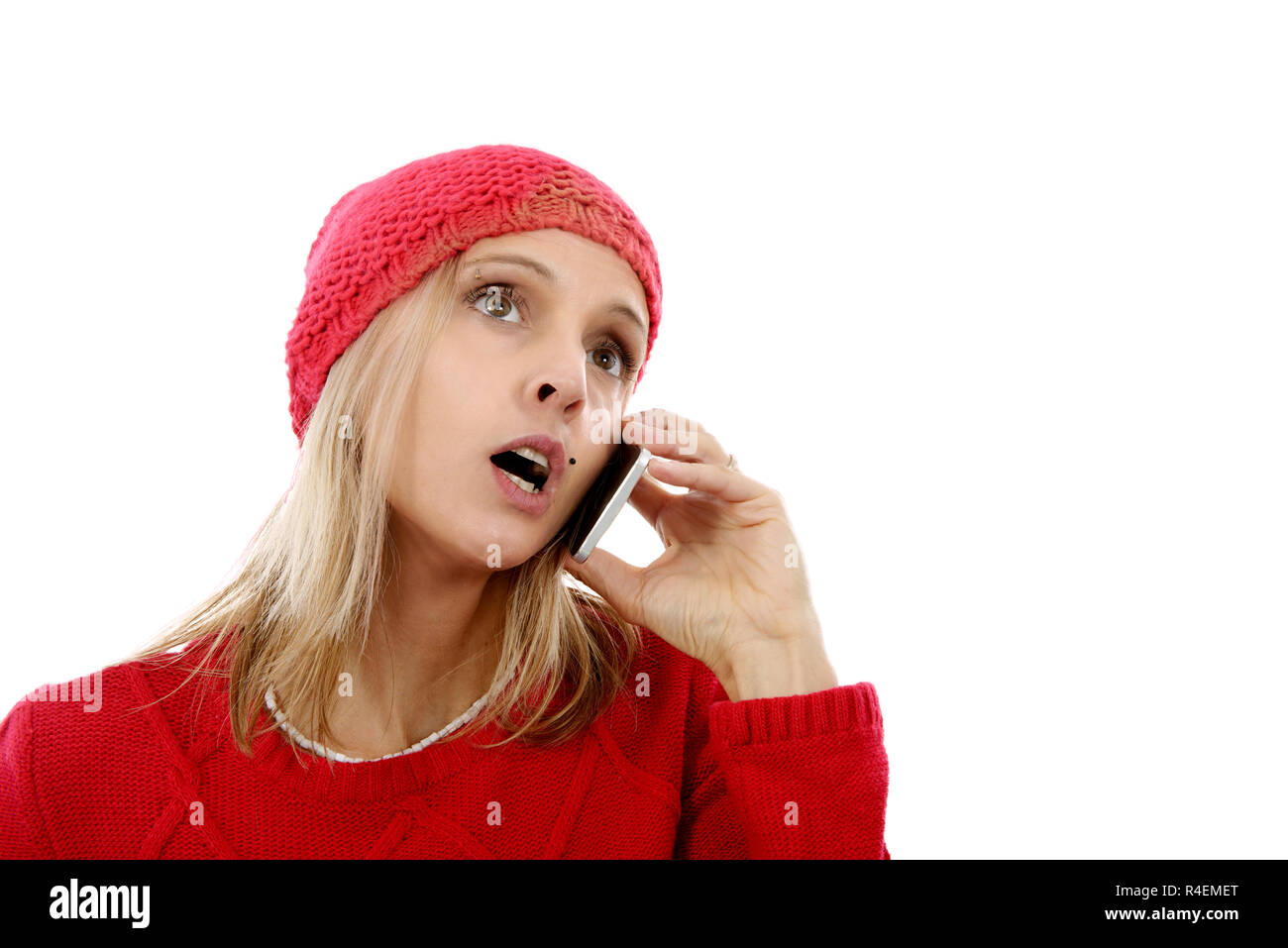 Beautiful young blonde woman with a red cap, phone Stock Photo - Alamy