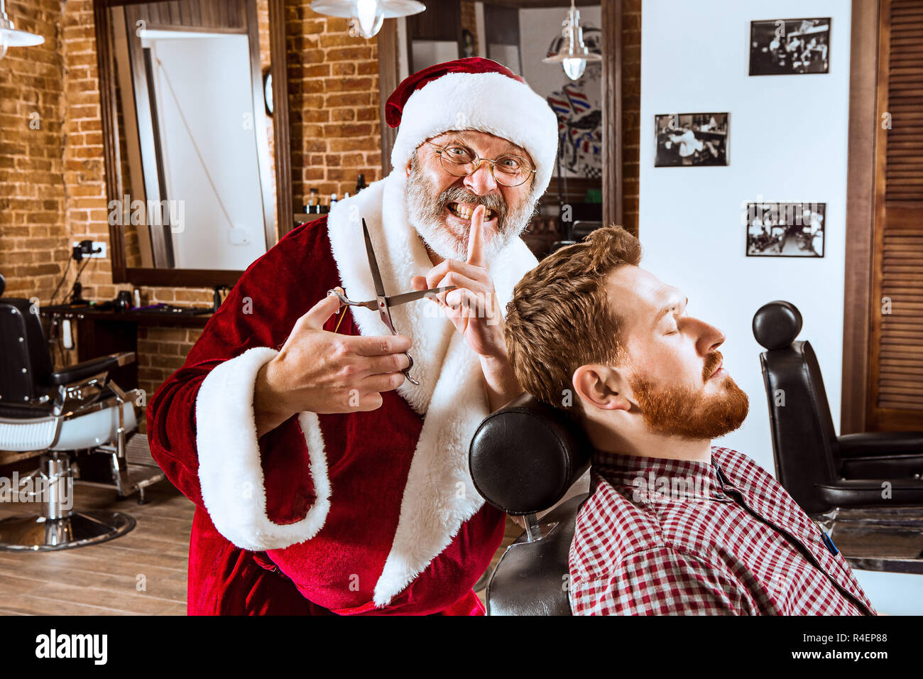 Santa claus as master at barber shop Stock Photo - Alamy
