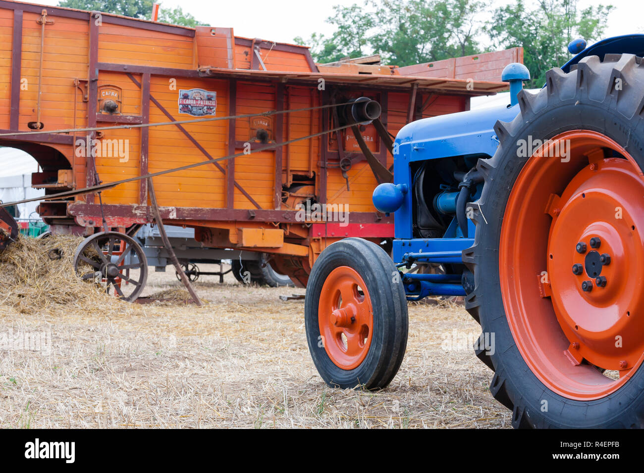 Tractot and straw baler Stock Photo - Alamy