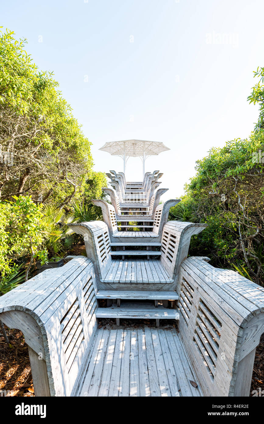 Closeup of vertical wooden pavilion stairs leading to beach ocean with ...