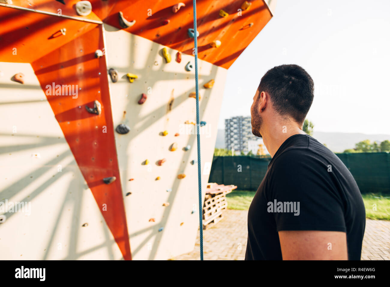 Fitness man while preparing for bouldering on artificial wall Stock ...